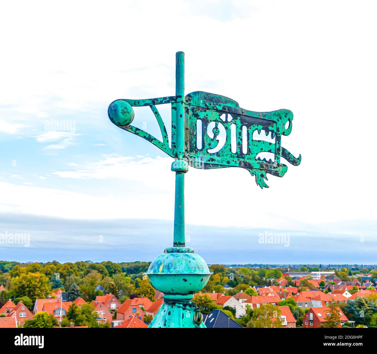 Old copper wind vane with green patina, shaped like a dragons head ...