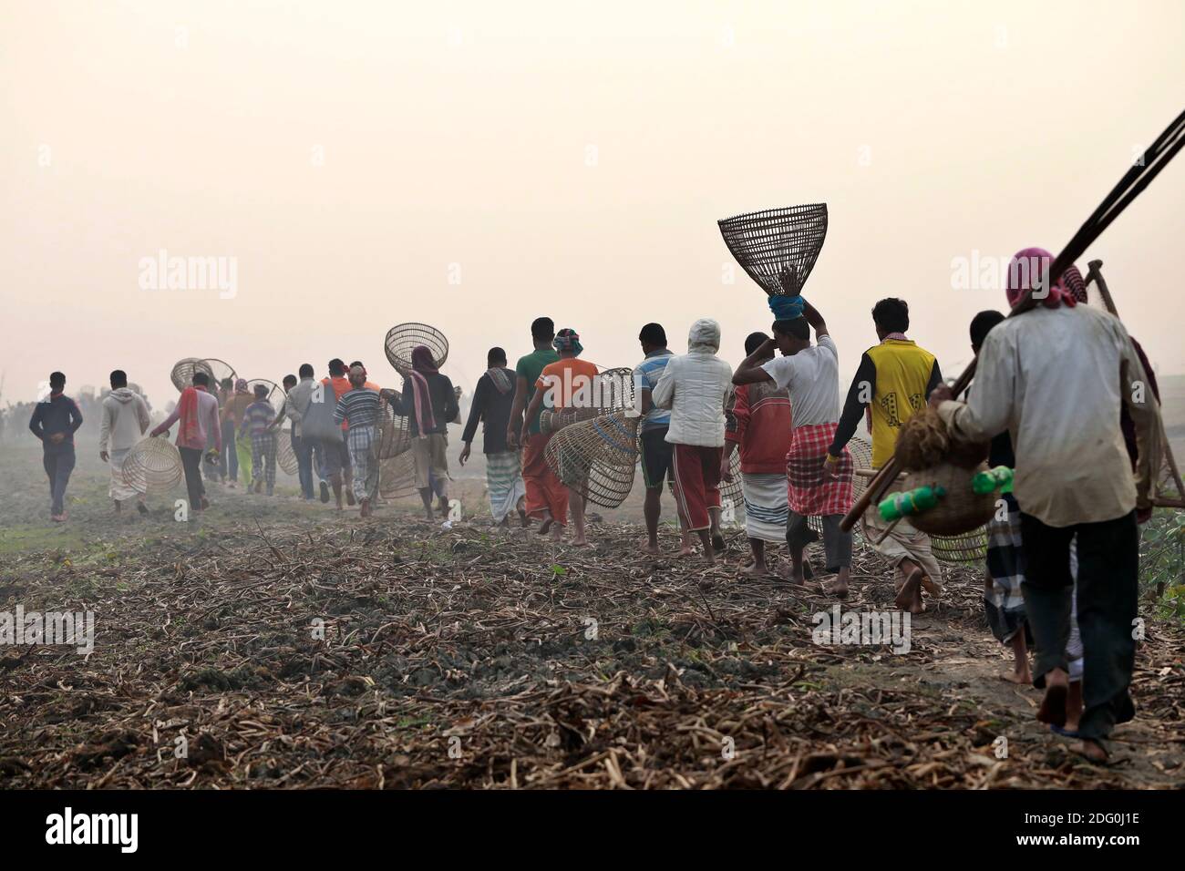 Pabna, Bangladesh - December 05, 2020: People line up in groups to ...