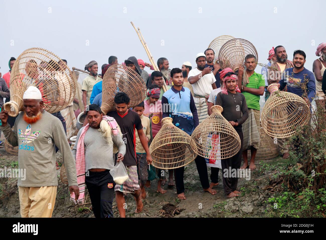 Pabna, Bangladesh - December 05, 2020: People line up in groups to ...