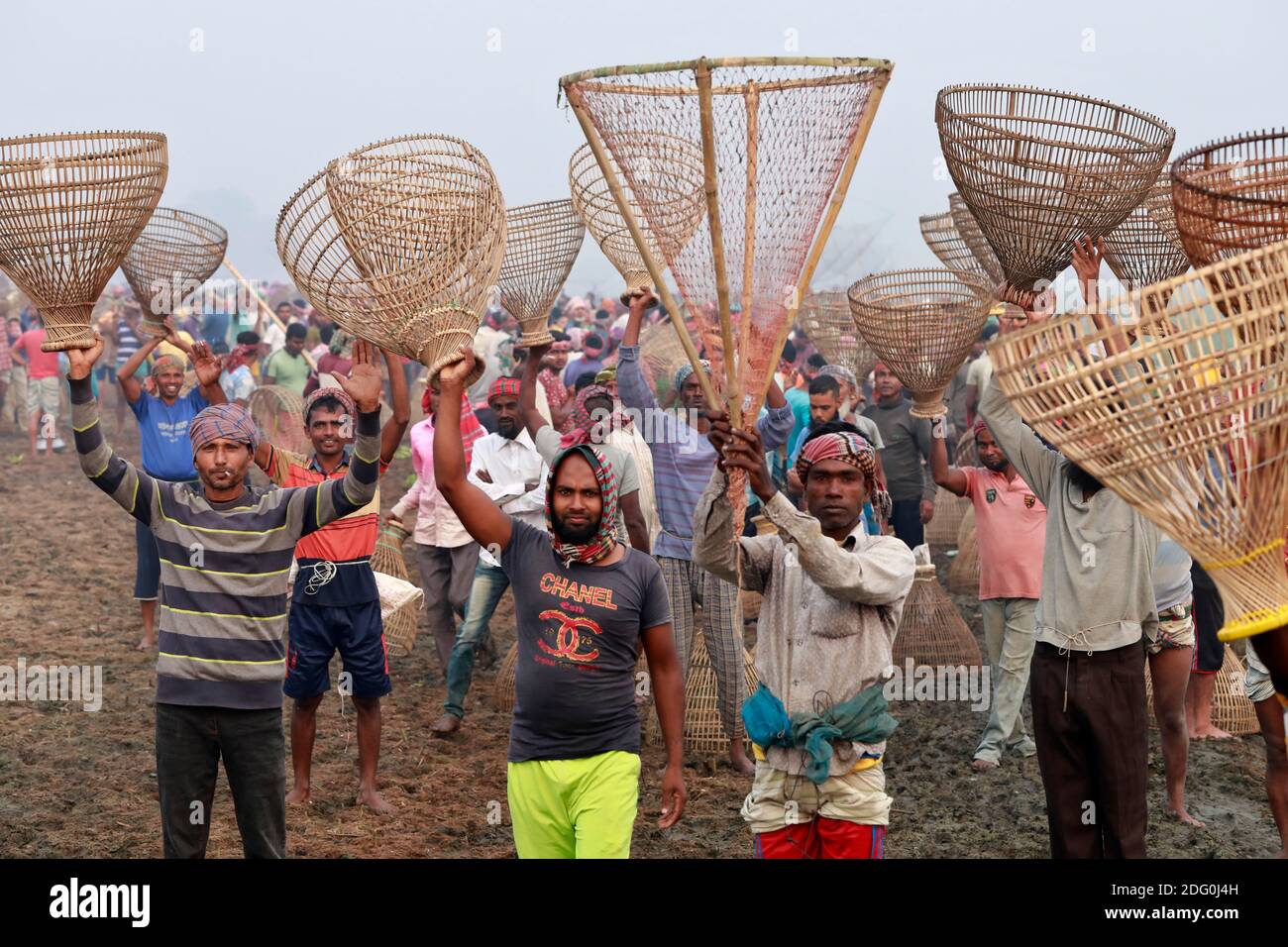 Pabna, Bangladesh - December 05, 2020: People line up in groups to ...
