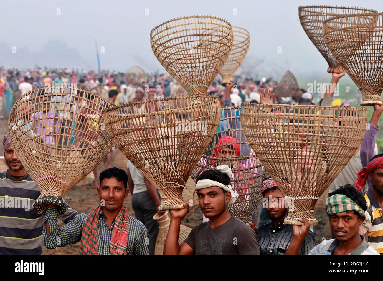 Pabna, Bangladesh - December 05, 2020: People line up in groups to ...
