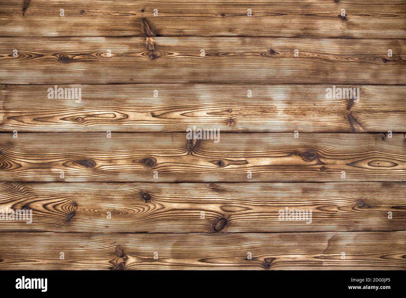 Wooden background. Aged boards by firing and brushing. A beautiful ...
