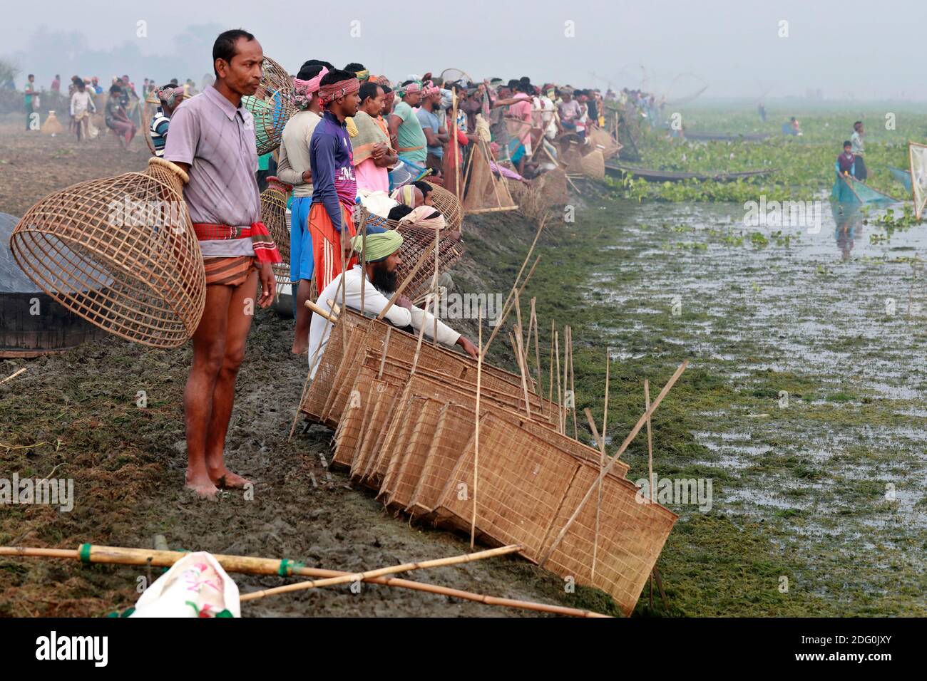 Pabna, Bangladesh - December 05, 2020: People line up in groups to ...