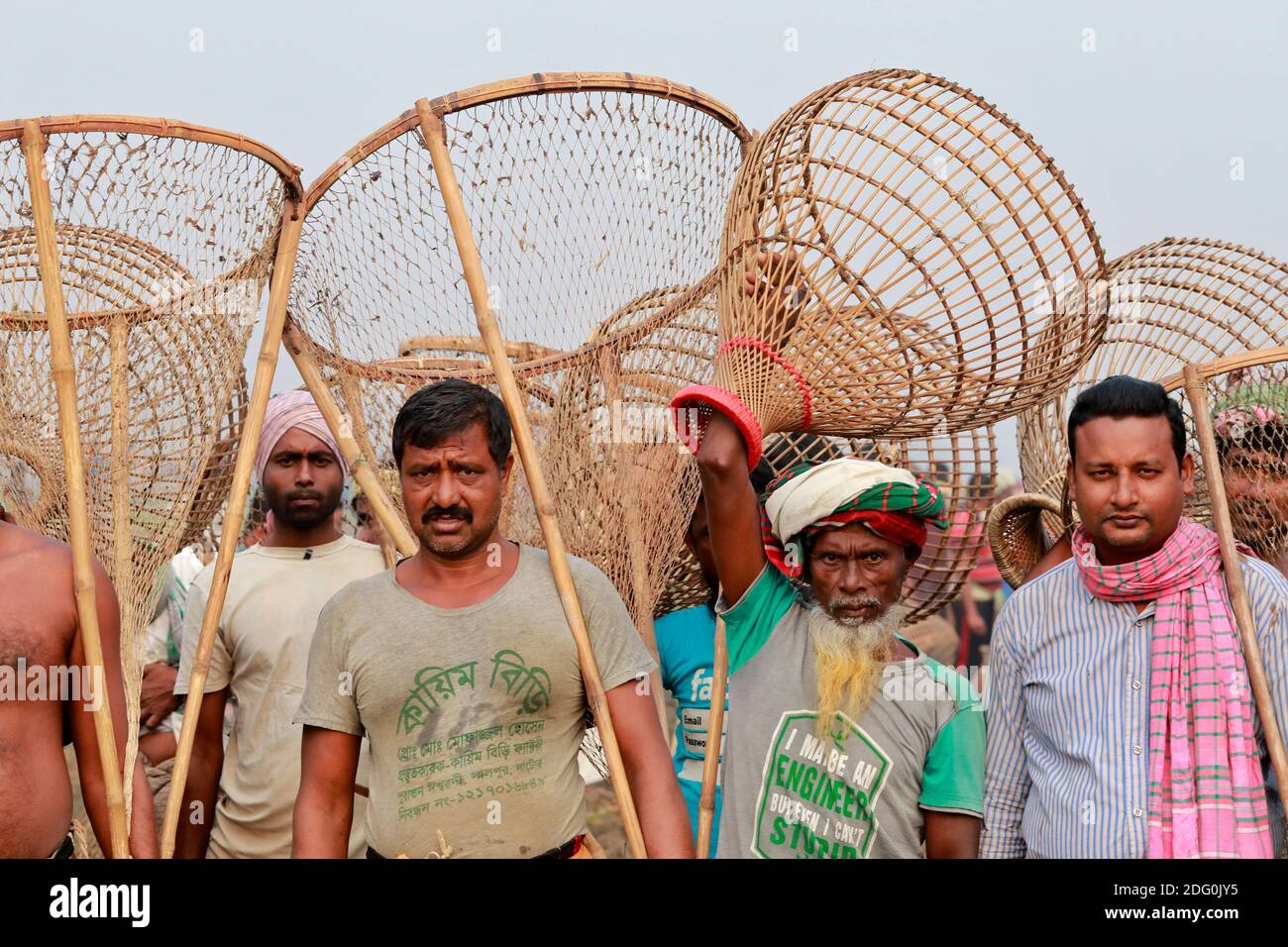 Pabna, Bangladesh - December 05, 2020: People line up in groups to ...
