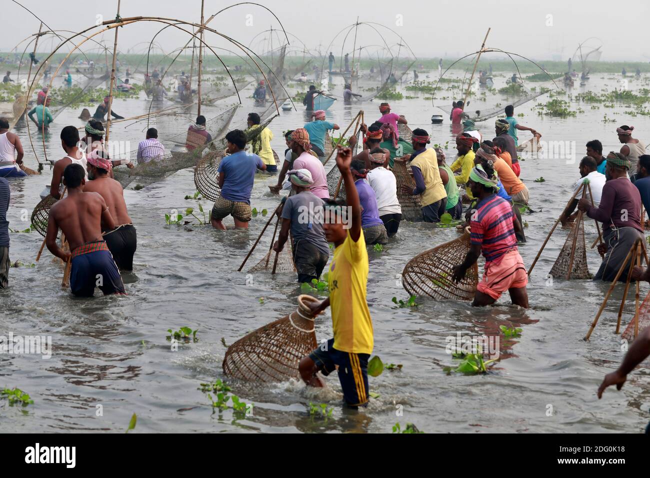 Pabna, Bangladesh - December 05, 2020: People line up in groups to ...