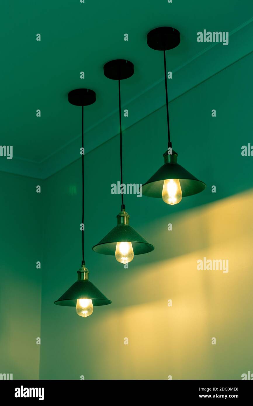 Three lamps with vintage incandescent bulbs with warm light Stock Photo ...