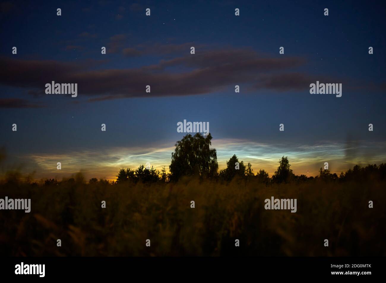 silvery clouds at night over the fields of the countryside Stock Photo ...