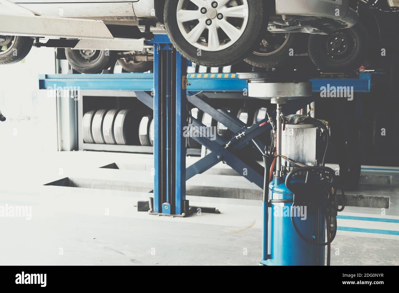 motor oil container for filling old engine oil from car in automobile ...