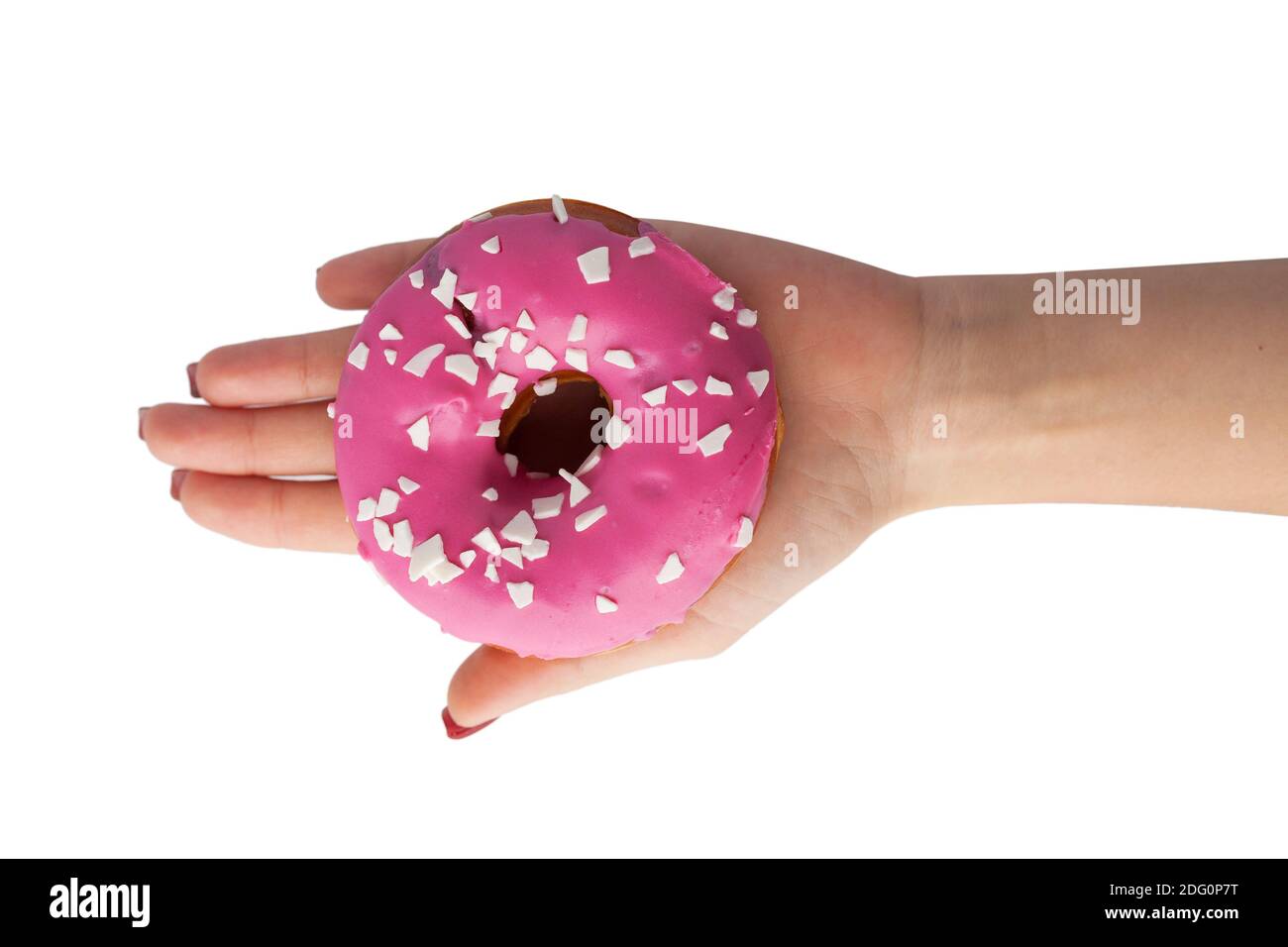 Female hand holds with fingers a donut in pink glaze isolated on white ...