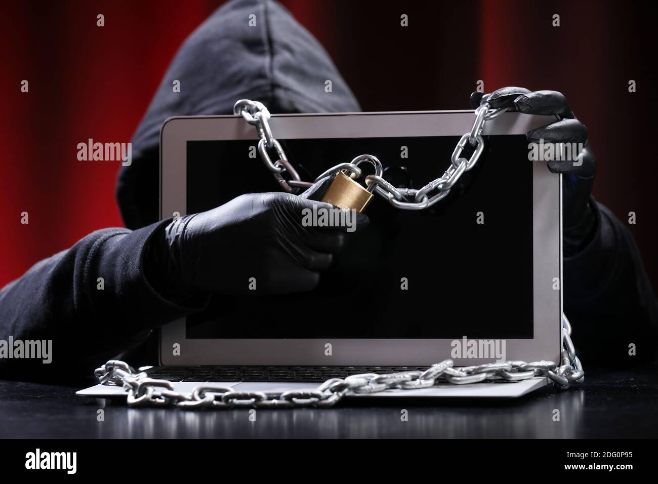 International hacker in black pullover and black mask trying to hack ...