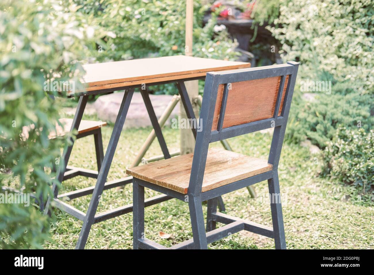 wooden chair seat for resting in garden park Stock Photo - Alamy