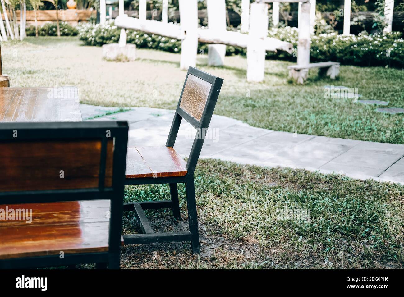 wooden chair seat for resting in garden park Stock Photo - Alamy