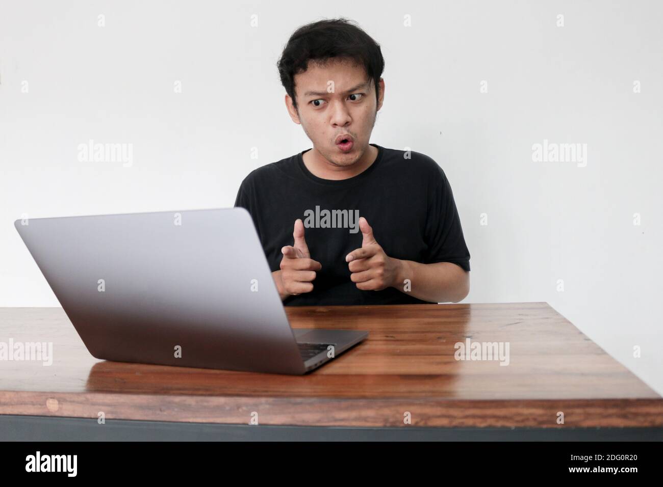 Wow face of Young Asian man shocked what he see in the laptop when ...