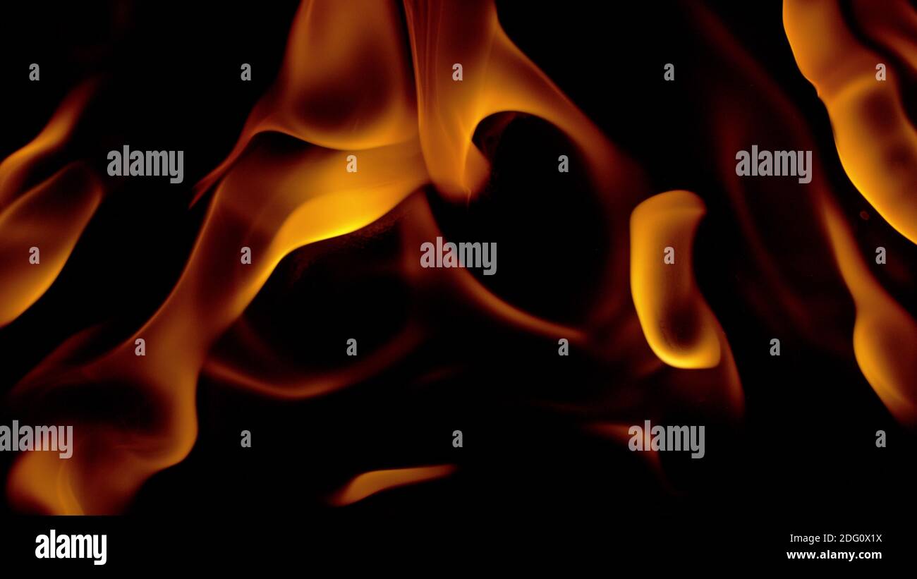 Fire flames abstract wavy background, isolated on black Stock Photo - Alamy