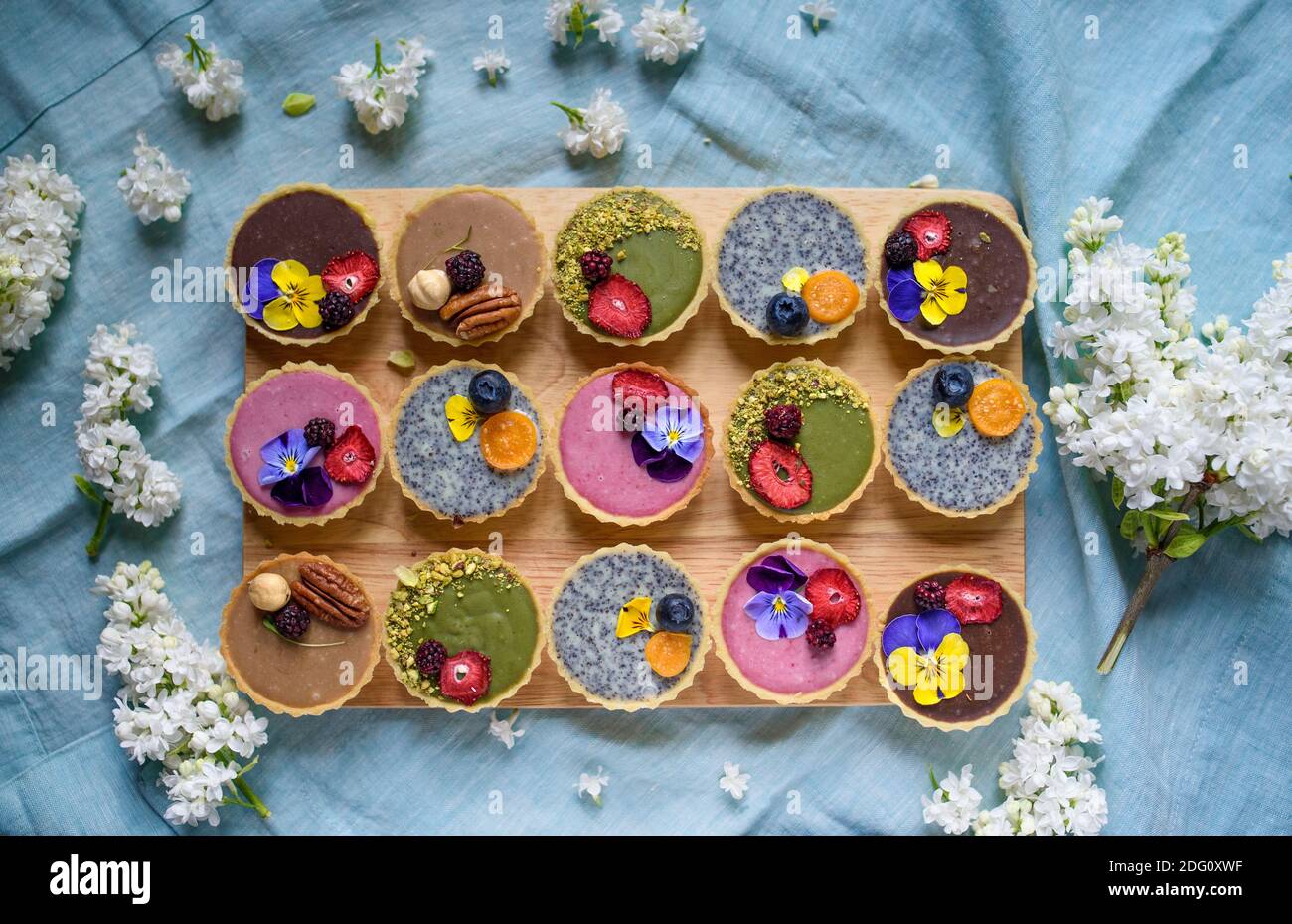 Top view of selection of colorful and delicious cake desserts in box on ...
