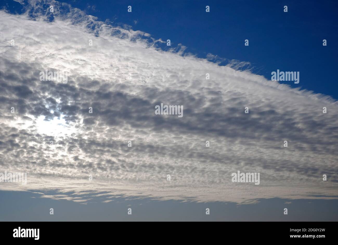 bank of white wispy cloud on blue sky background, norfolk, england ...