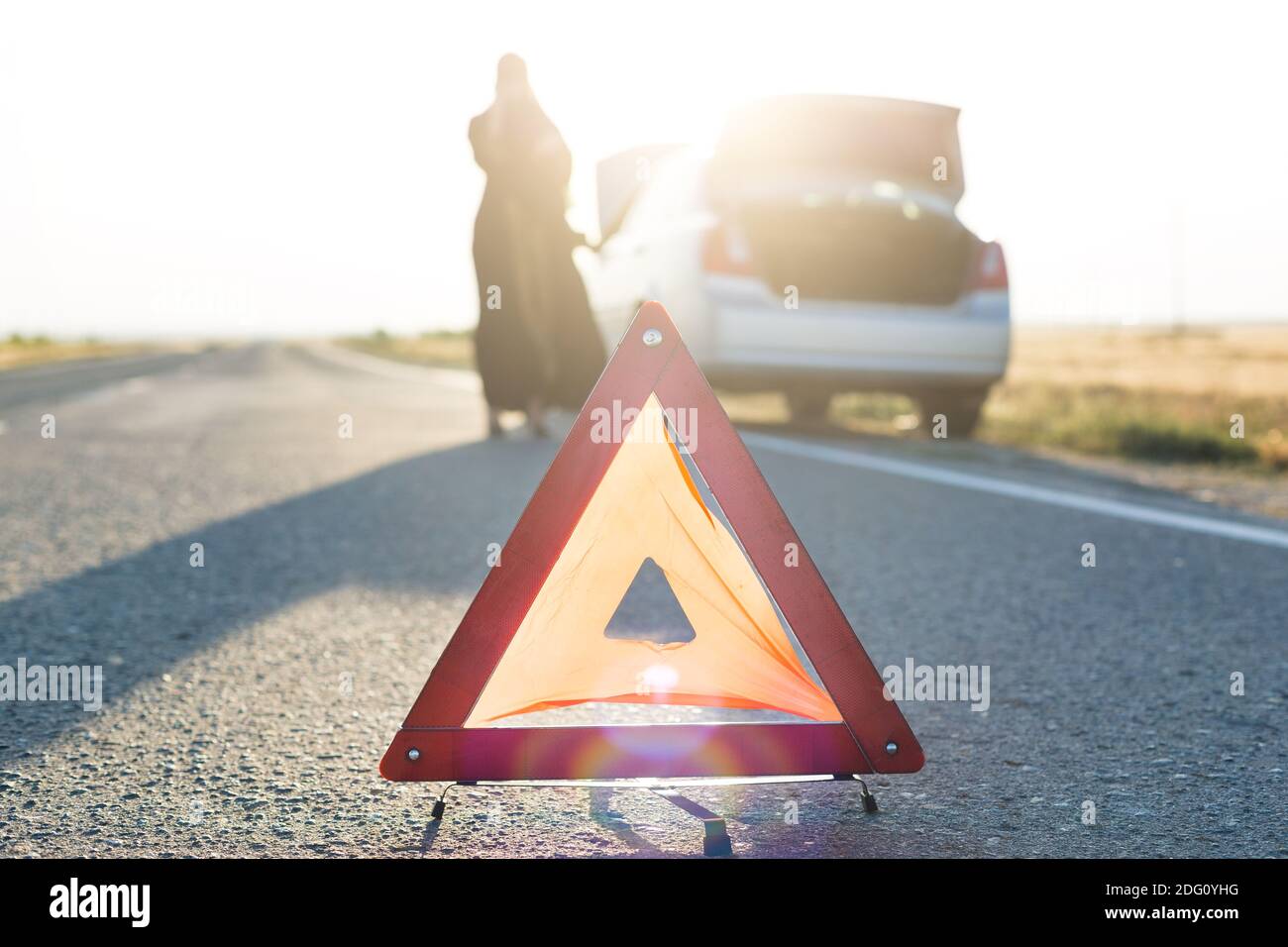 Car breakdown on the road, warning sign on the asphalt Stock Photo - Alamy