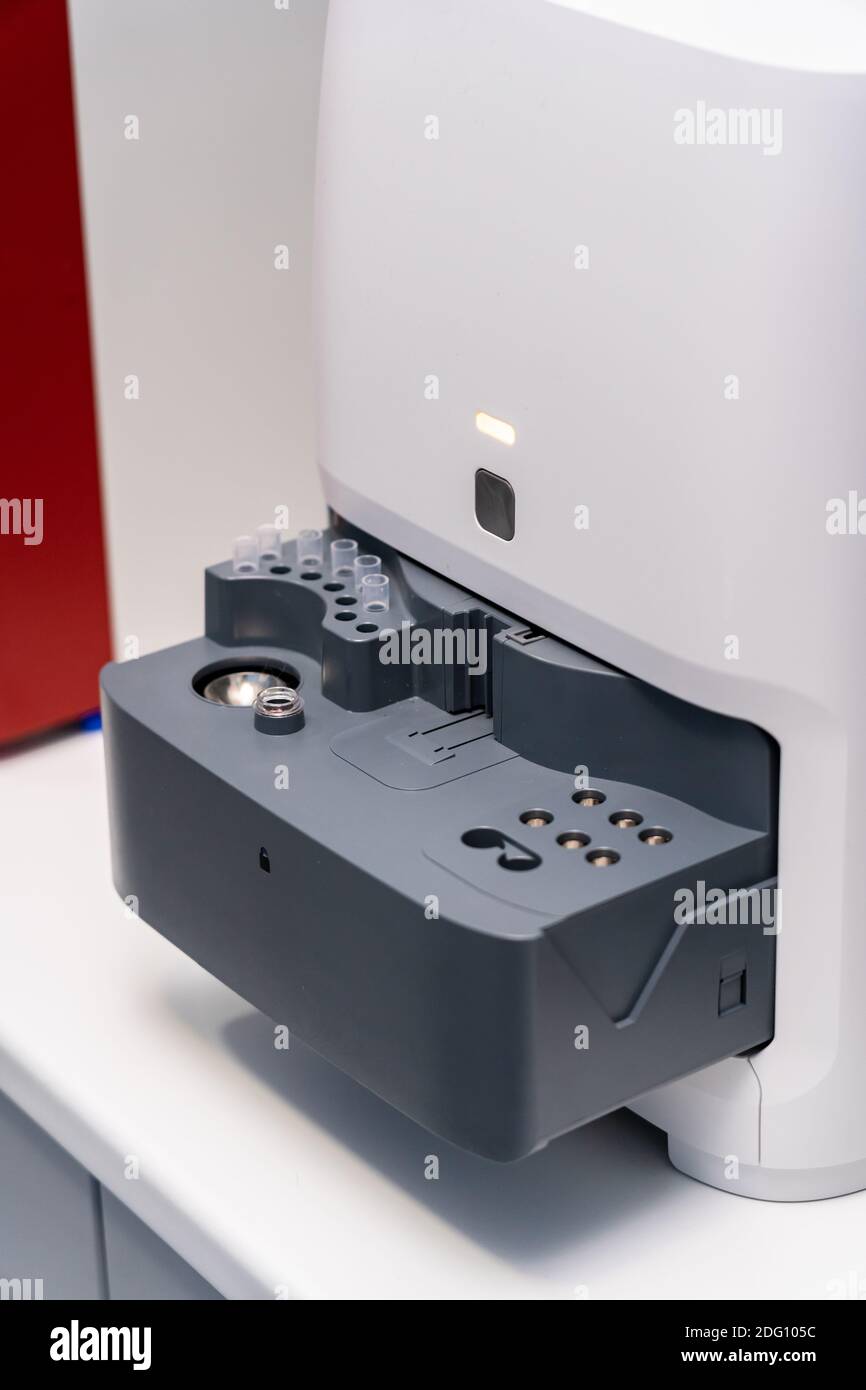 Introduction of blood samples in a biochemistry machine Stock Photo - Alamy