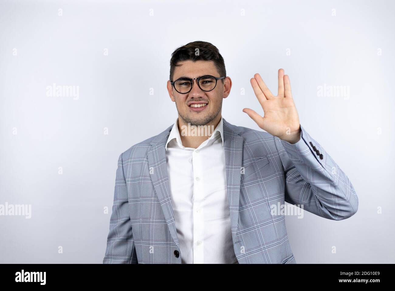 Business young man wearing a casual shirt over white background doing ...