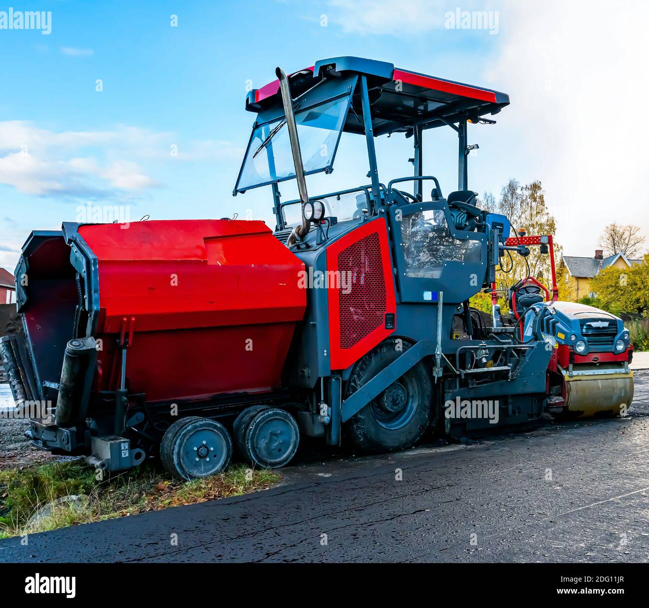 Large paver finisher machine for laying asphalt on sidewalks and roads ...