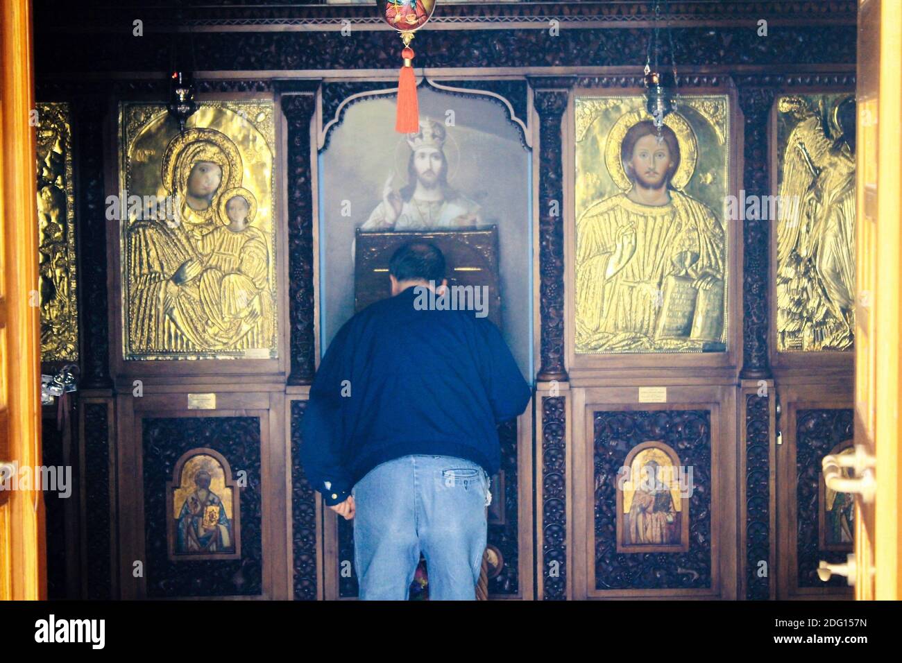 Pilgrims praying inside a Greek orthodox church in Athens, Greece ...