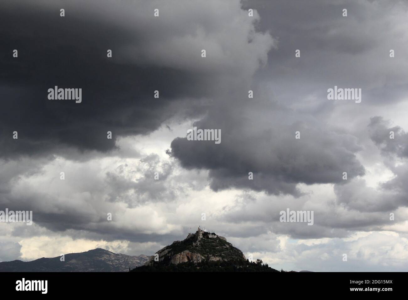 Stormy weather sky with dark clouds in Athens, Greece with Lycabetus ...