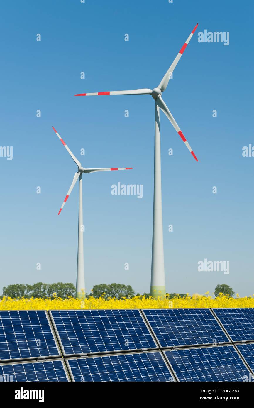 Solar modules and wind turbines in a rape field Stock Photo - Alamy