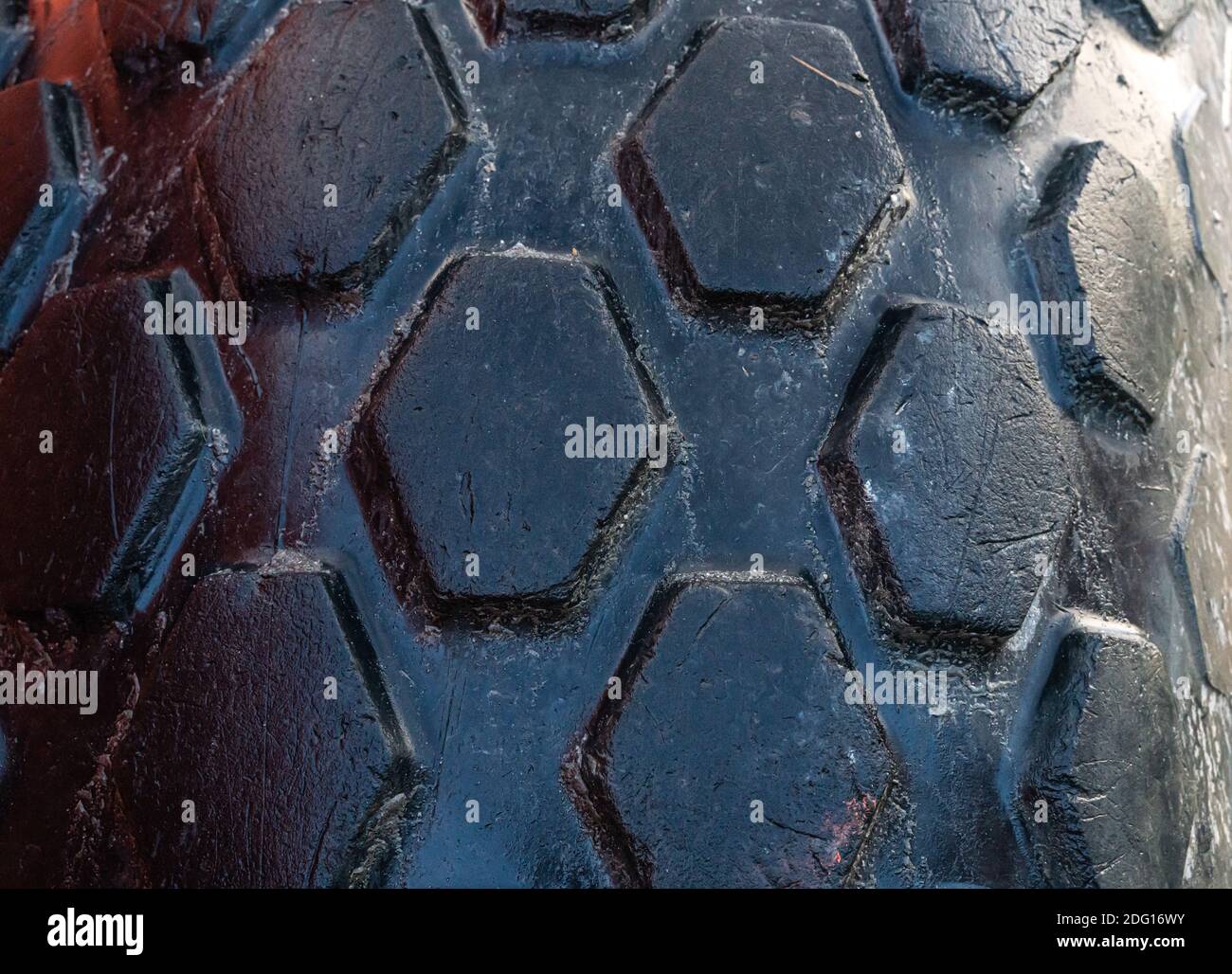 Tire treads on the rubber tire of a large construction machine. Close ...