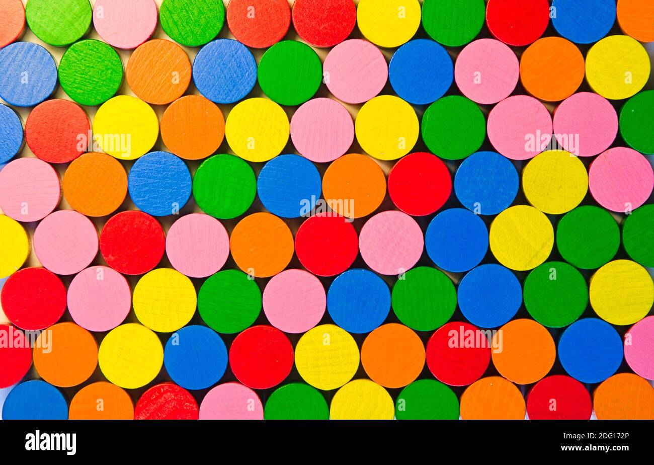 Colourful round wooden tokens Stock Photo - Alamy