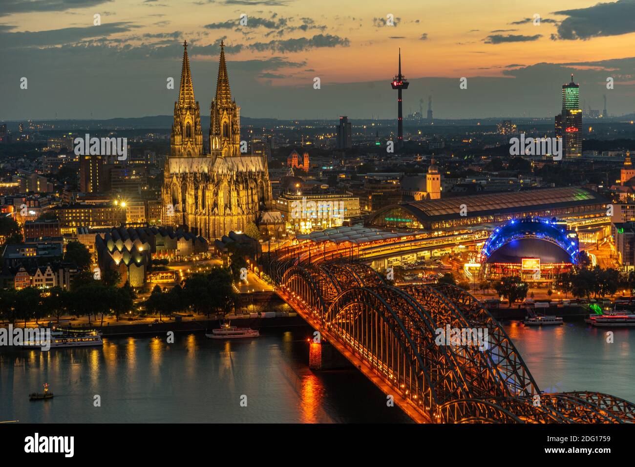 A dramatic sunset cloudscape over Cologne cityscape with a view of ...
