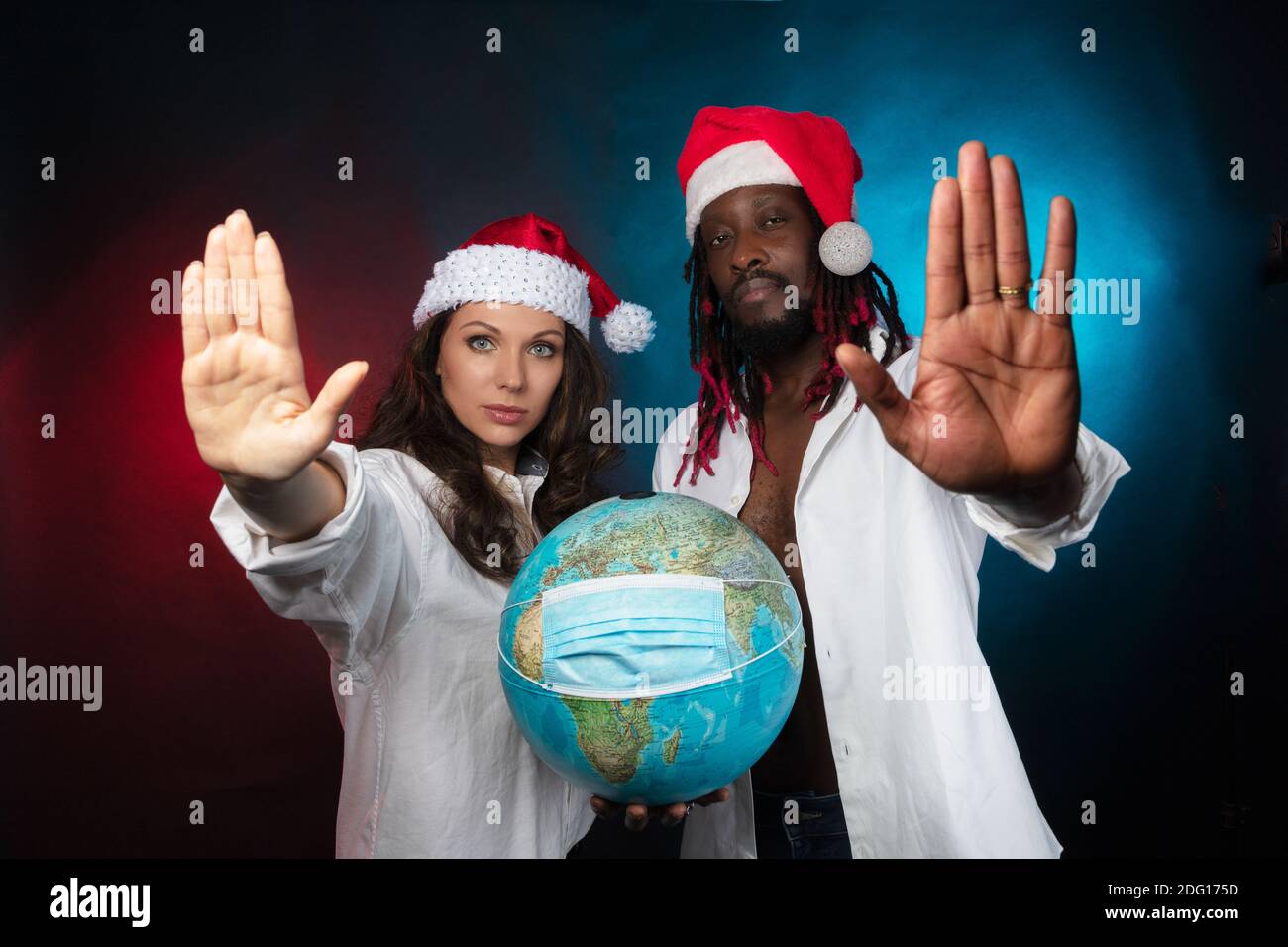A black man and a European woman in Christmas spats, holding a glotus ...