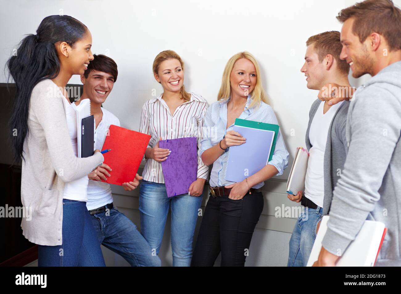 Laughing students have a break Stock Photo - Alamy