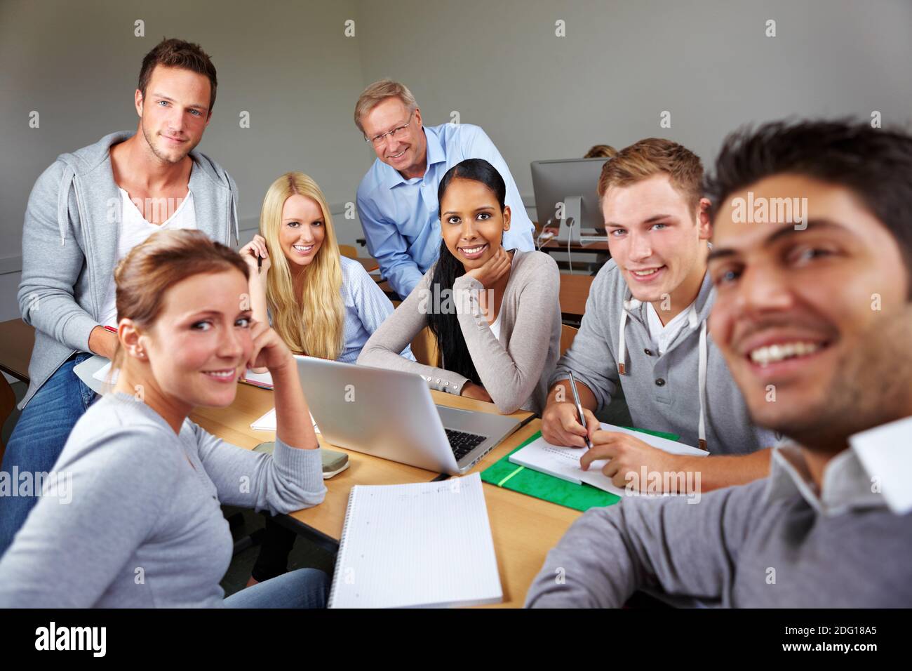 Happy students with lecturer Stock Photo - Alamy