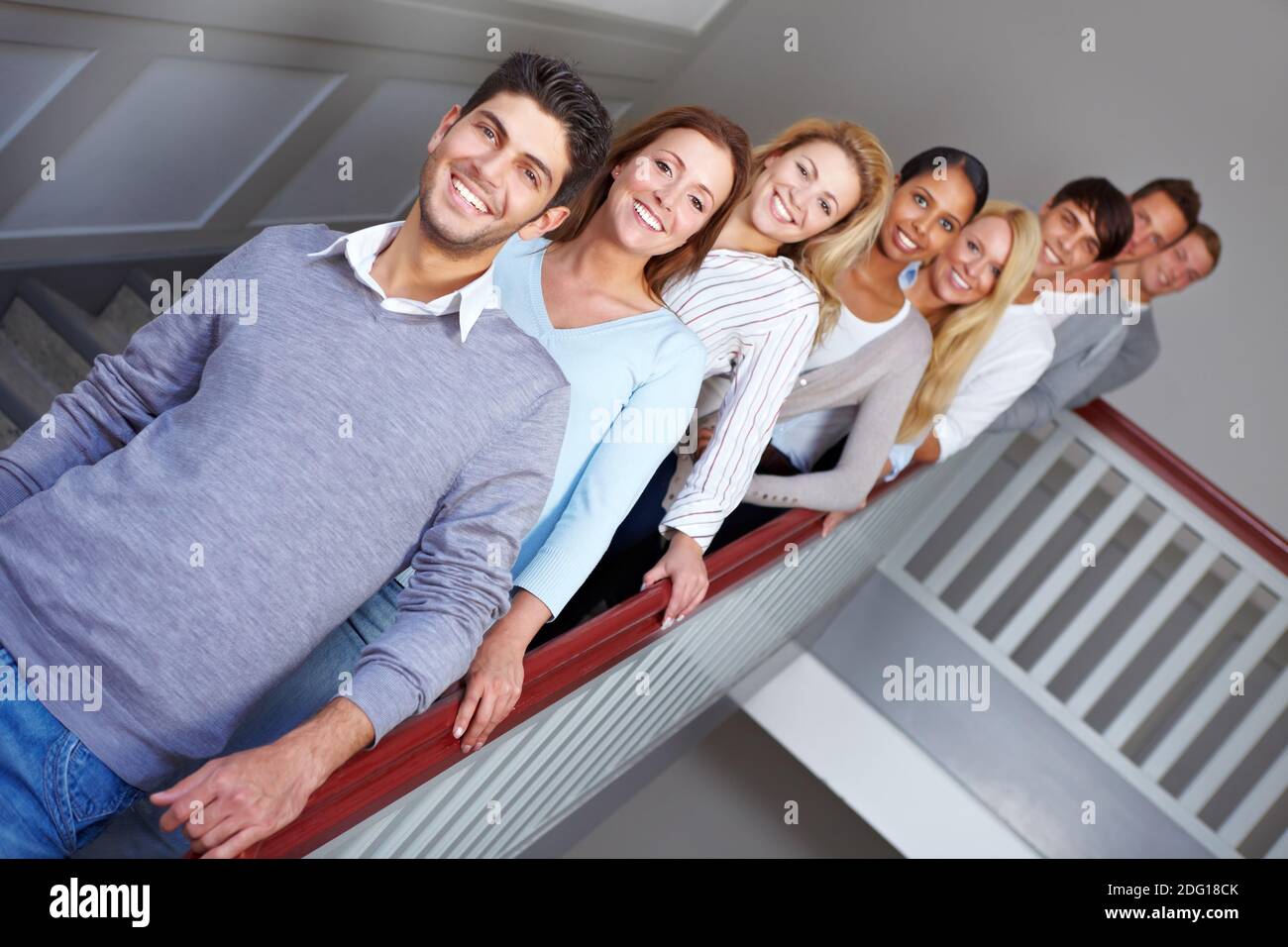 Young people in a row Stock Photo - Alamy