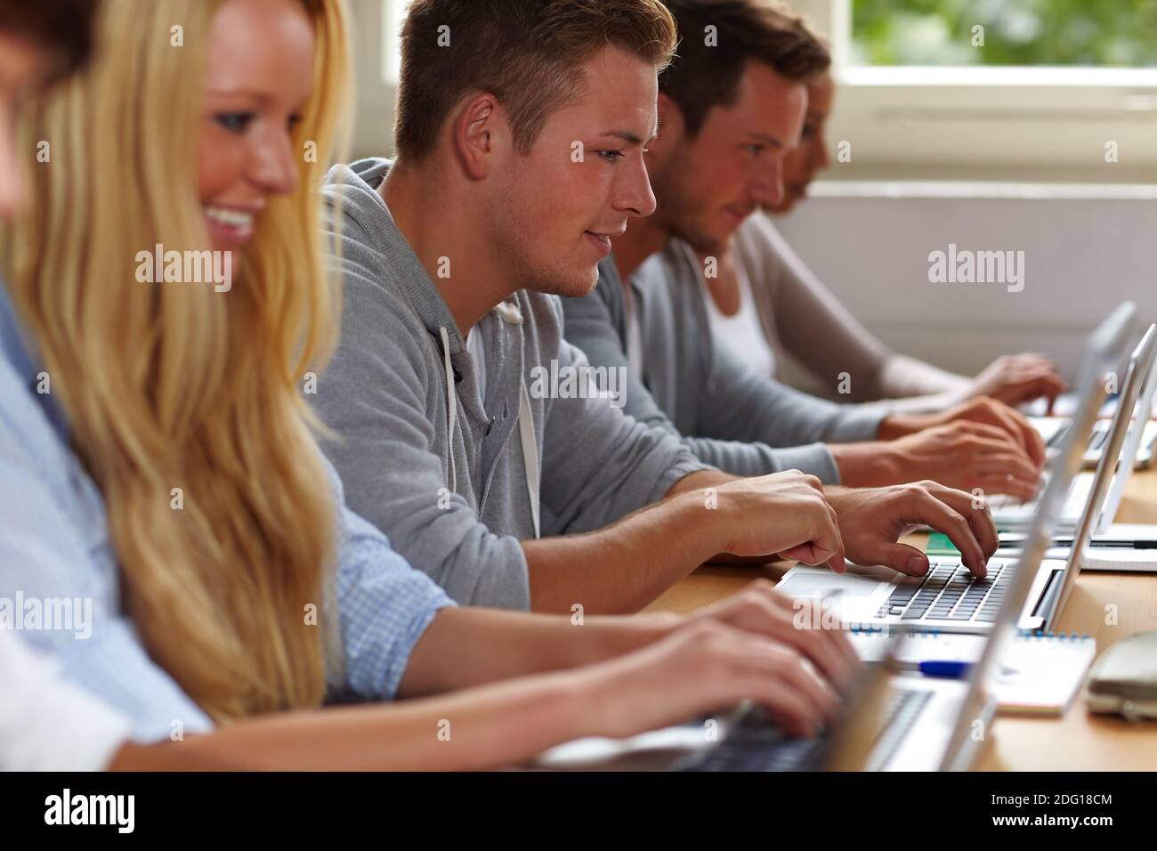 Students learn with laptops Stock Photo - Alamy