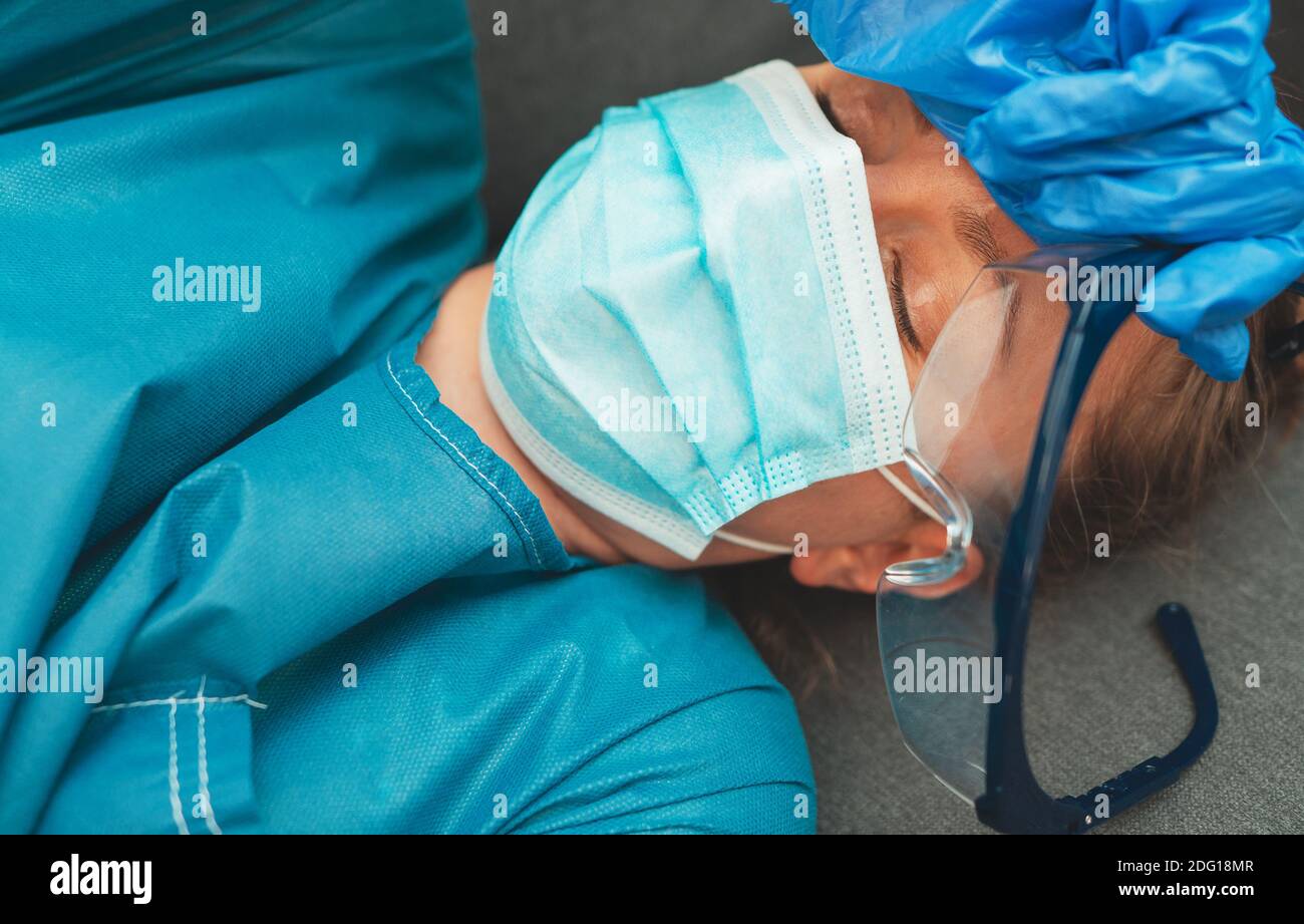 Tired medical worker after a shift. Burnout at work Stock Photo - Alamy