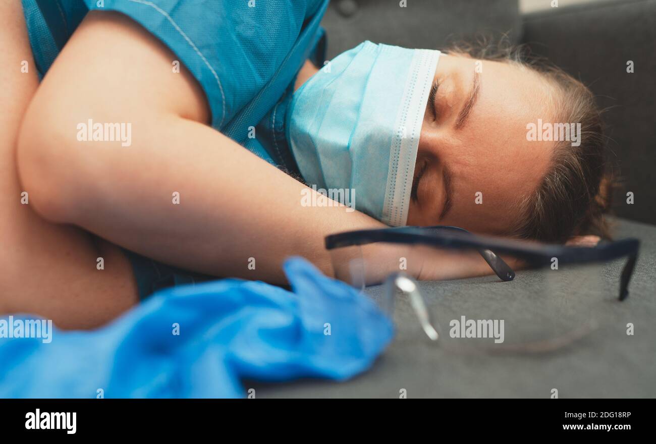 Tired medical worker after a shift. Burnout at work Stock Photo - Alamy