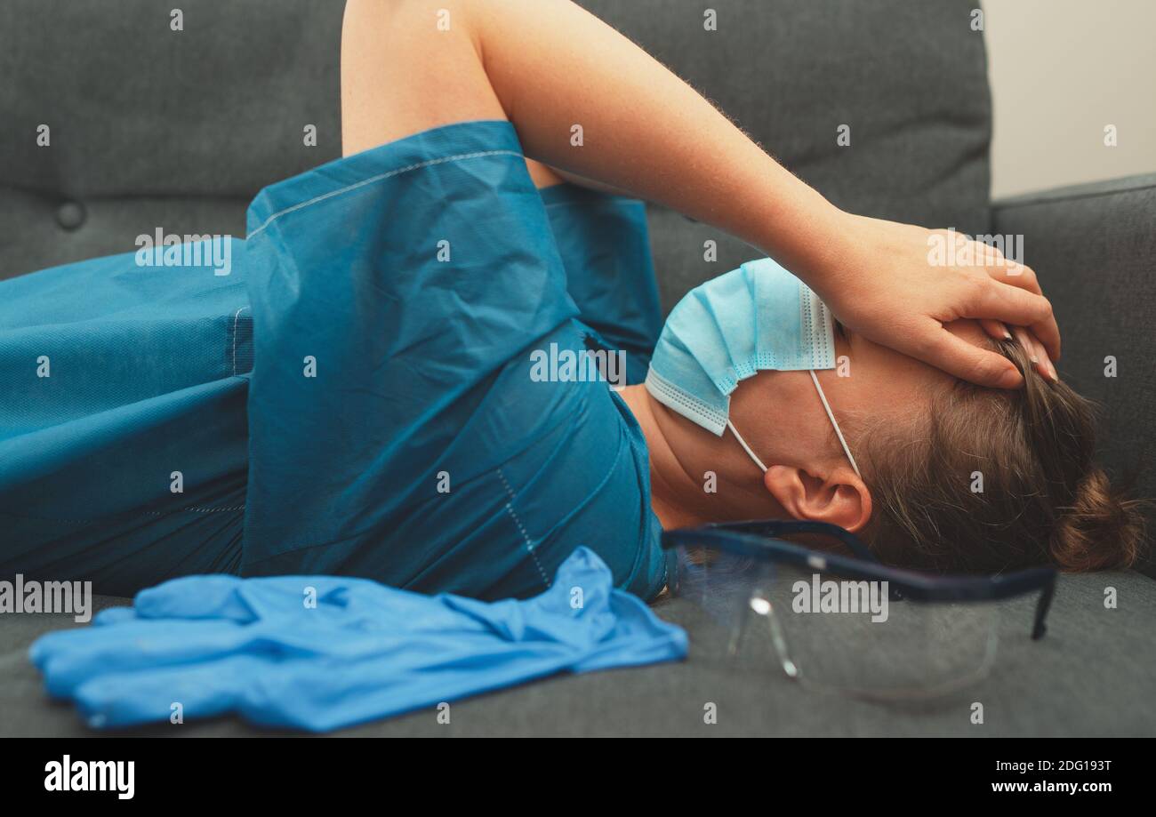Tired medical worker after a shift. Burnout at work Stock Photo - Alamy