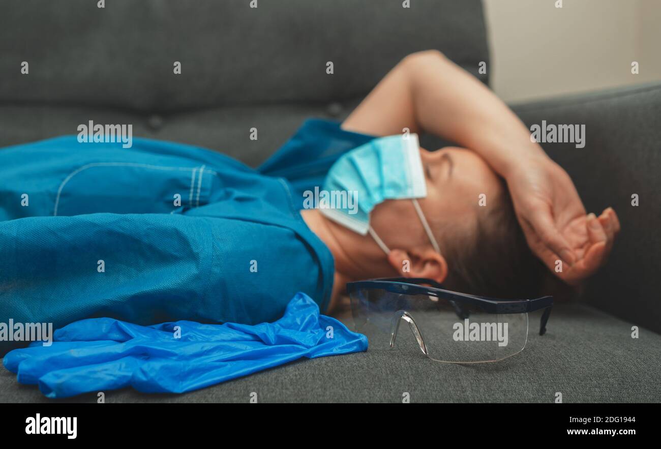 Tired medical worker after a shift. Burnout at work Stock Photo - Alamy