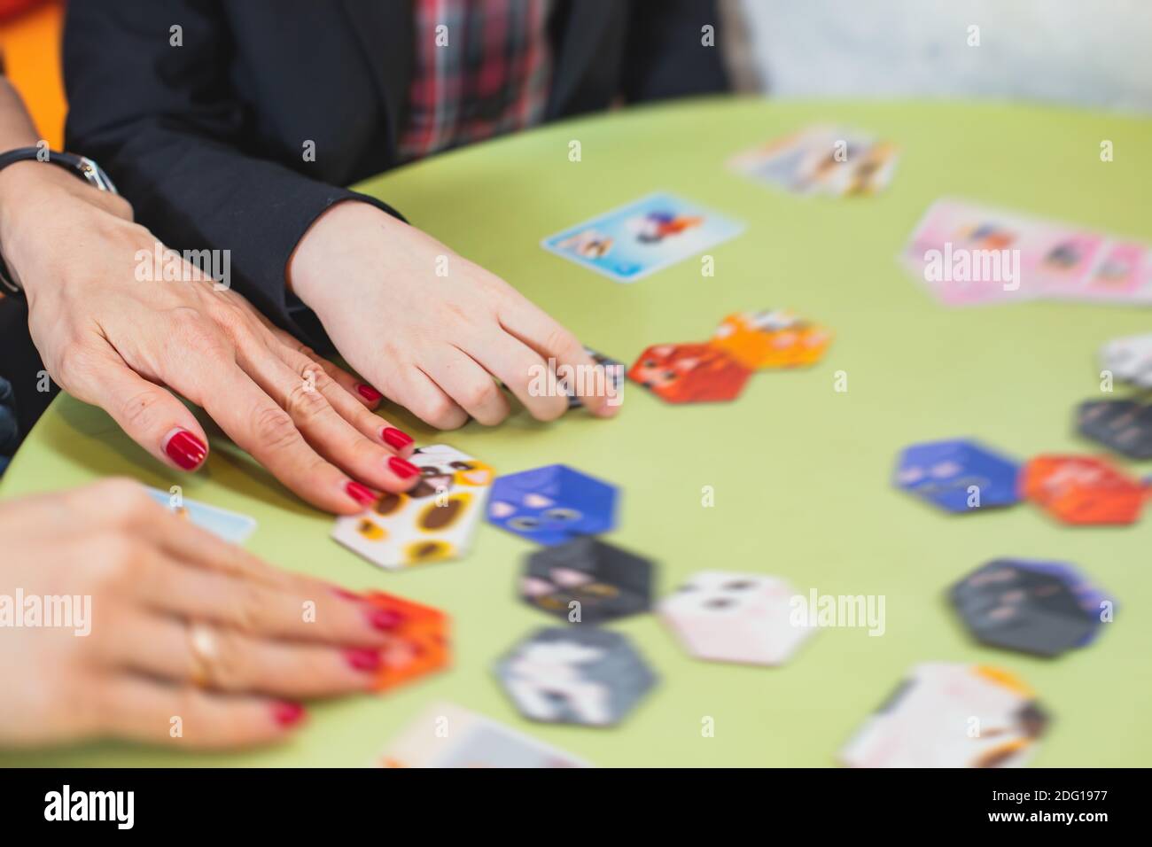 Process of playing board game and having fun with friends and family ...