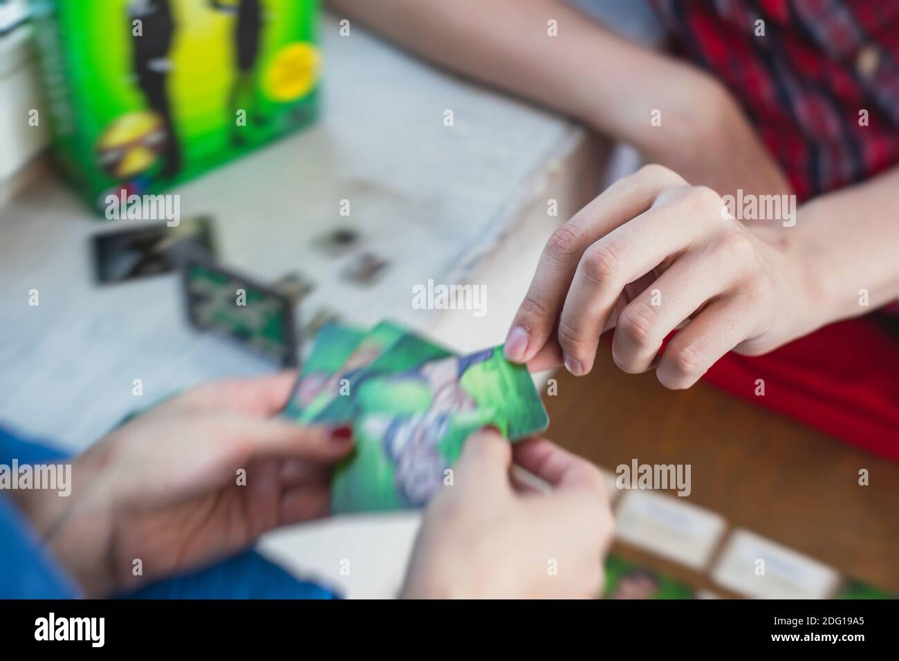Process of playing board game and having fun with friends and family ...
