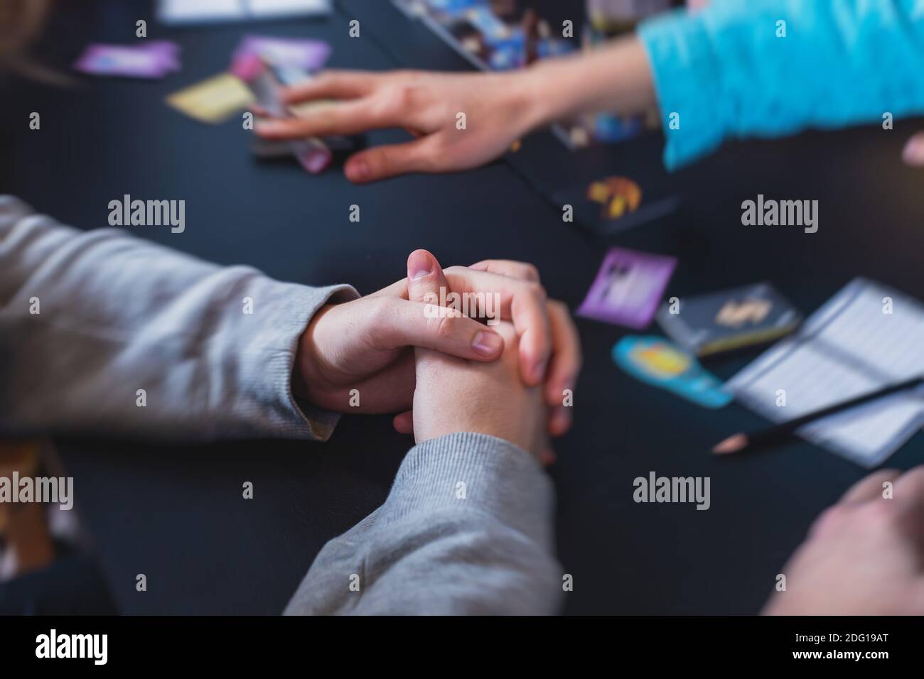 Process of playing board game and having fun with friends and family ...