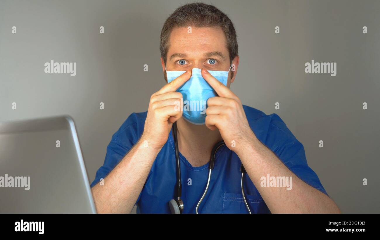 Medical doctor showing how to wear the mask during coronavirus lockdown ...