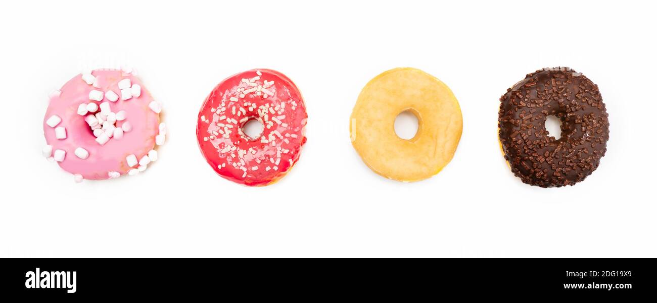 Four delicious round sweets on white background Stock Photo - Alamy