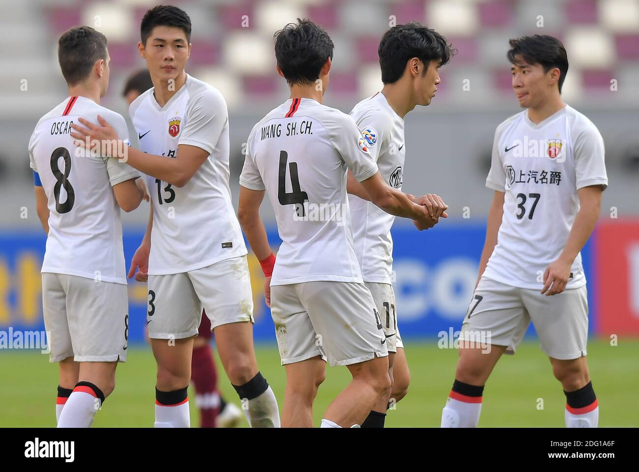 Doha, Qatar. 7th Dec, 2020. Players of Shanghai SIPG FC react after the ...