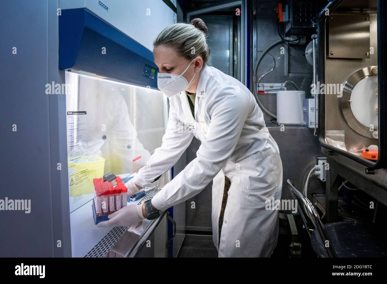 Biomedical Laboratory Technician Marshal Spinelli wearing a facemask ...