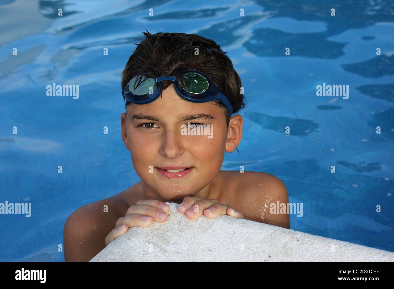 Boy with swimming goggles Stock Photo - Alamy