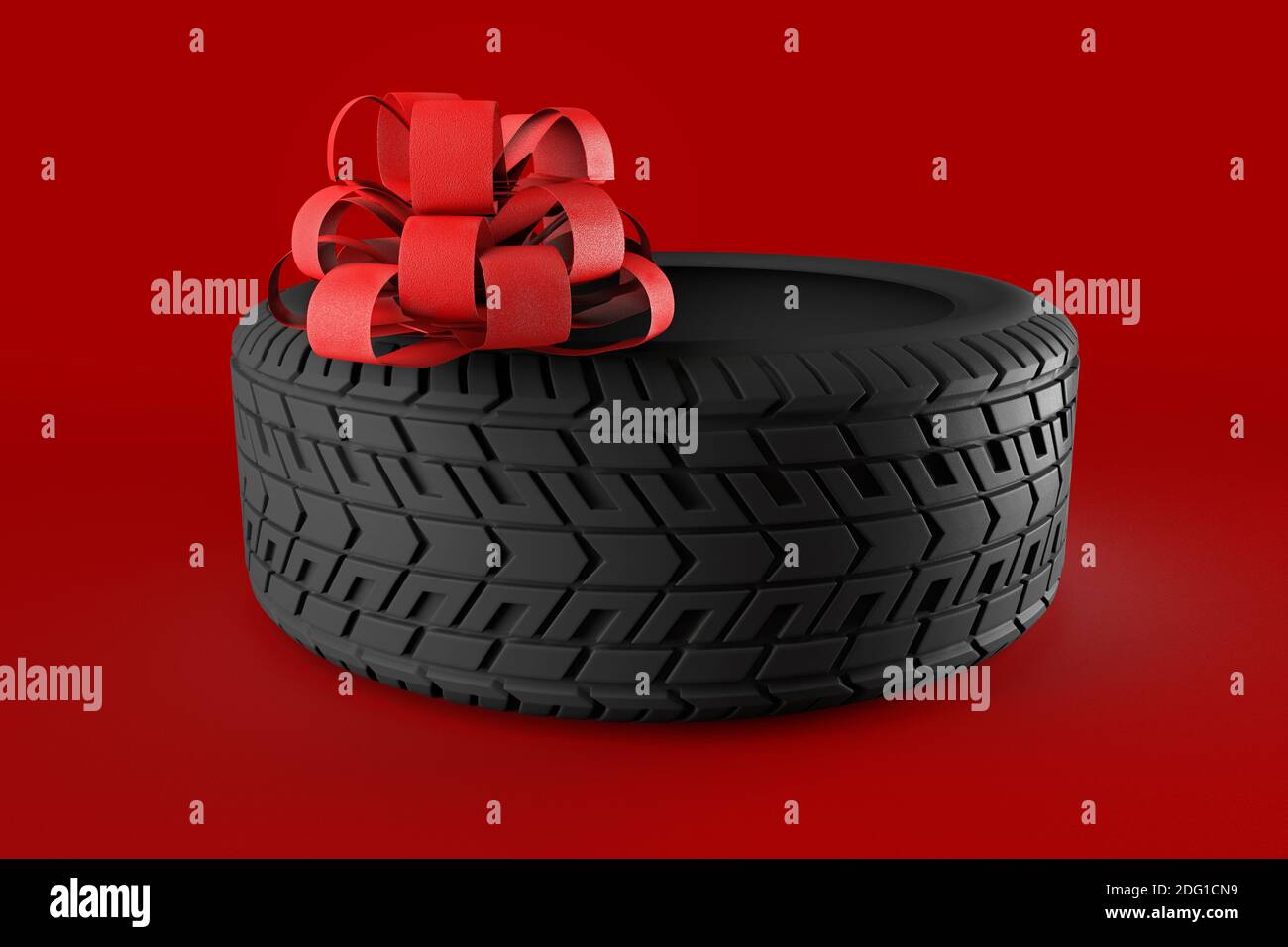 Car tire with red bow. Good graphics for a tire store, storage room ...