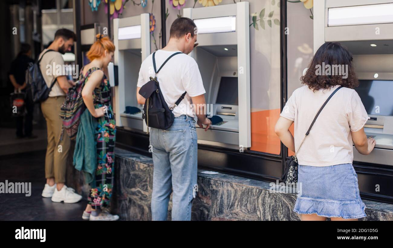 Line to ATM. Group of people waiting to withdraw money to bank card ...