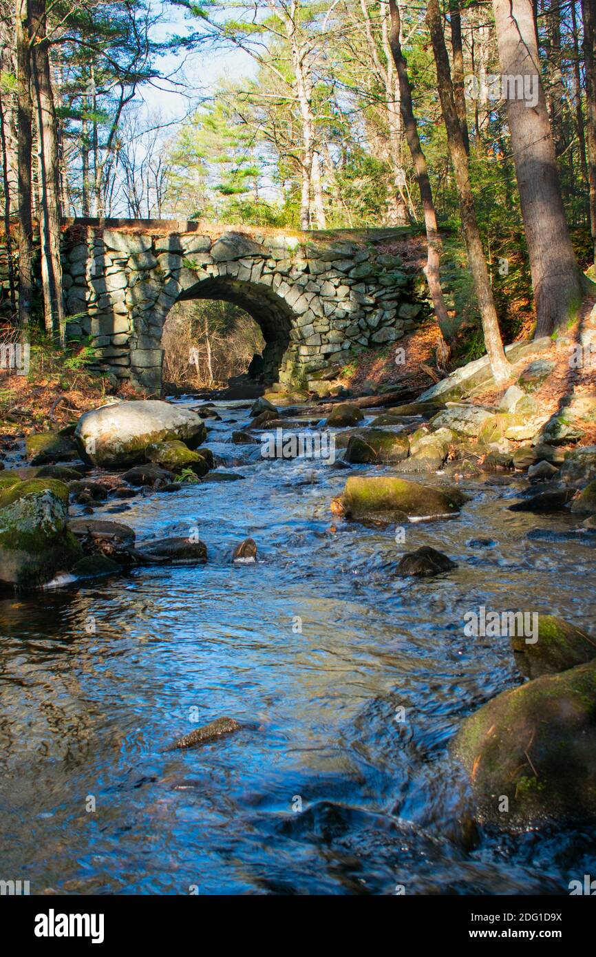 Hand constructed bridge built in 1866 spans a flowing stream Stock ...